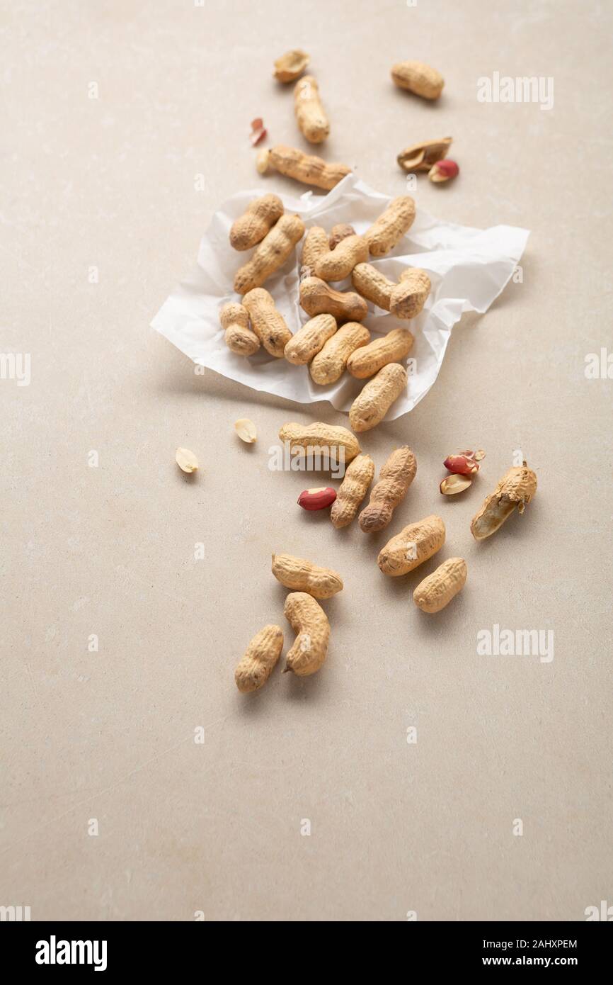 Bunch of peanuts nut on white paper, heathy food Stock Photo - Alamy