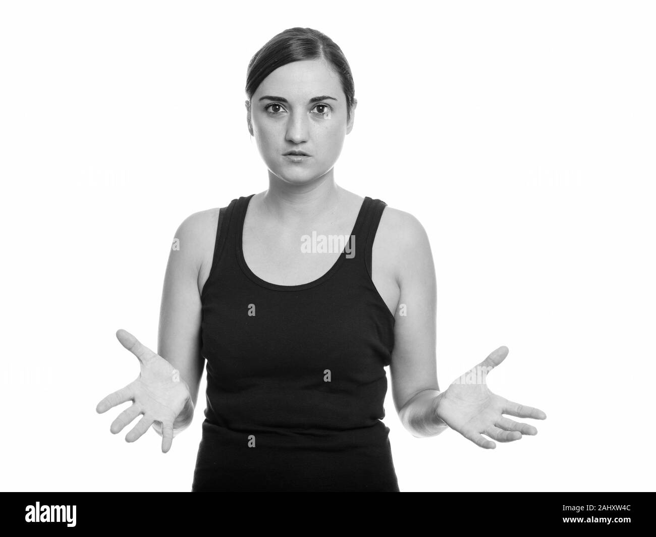 Studio shot of beautiful woman looking confused Stock Photo - Alamy Studio shot of beautiful woman looking confused Stock Photo - Alamy
