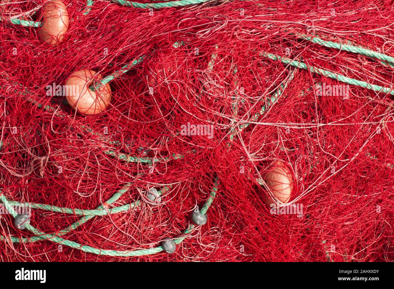 Red color fishing nets background Stock Photo - Alamy