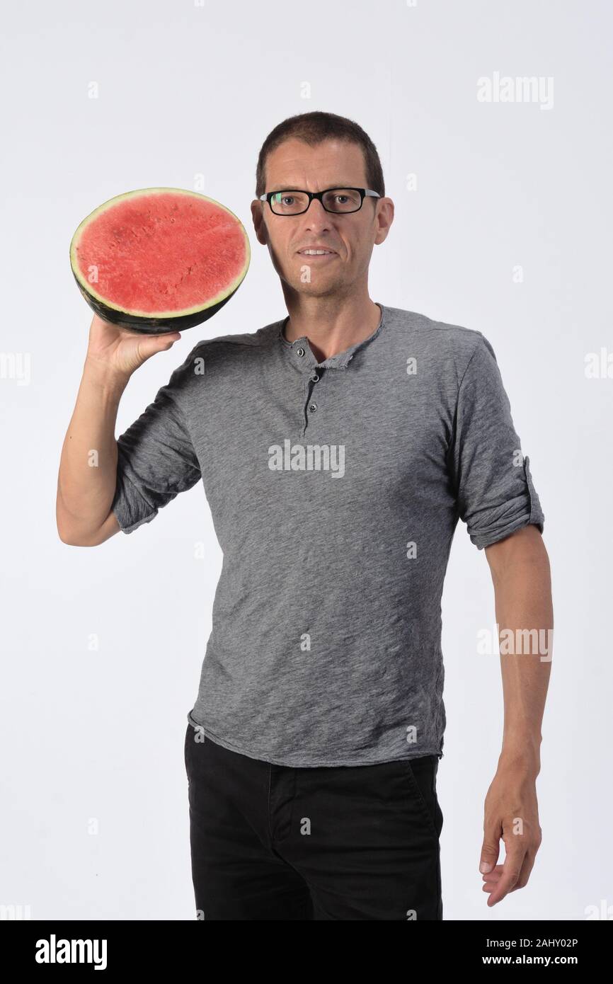 man with watermelon on white background Stock Photo - Alamy
