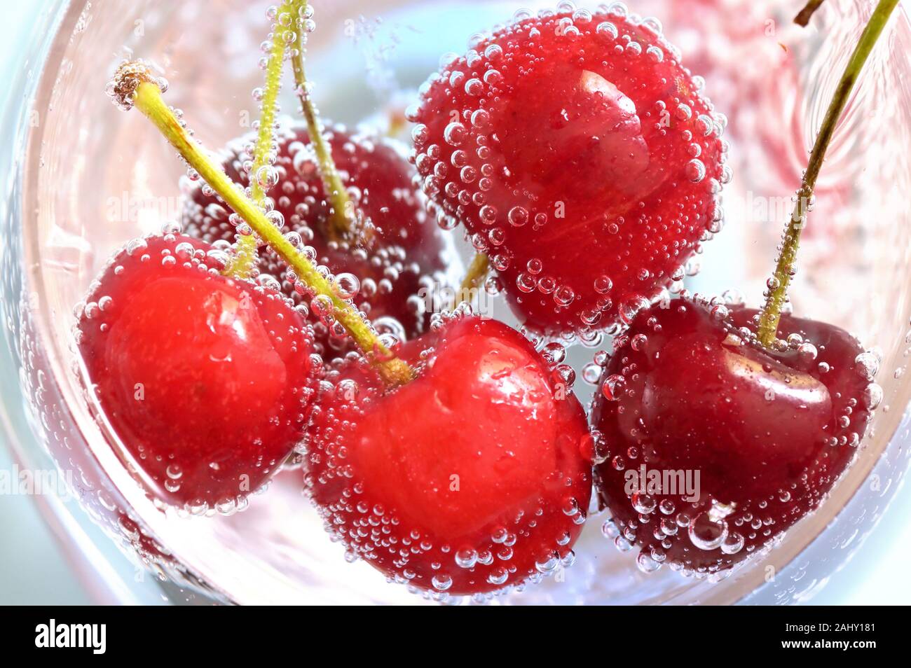 Cherry splash in transparent water hi-res stock photography and images ...