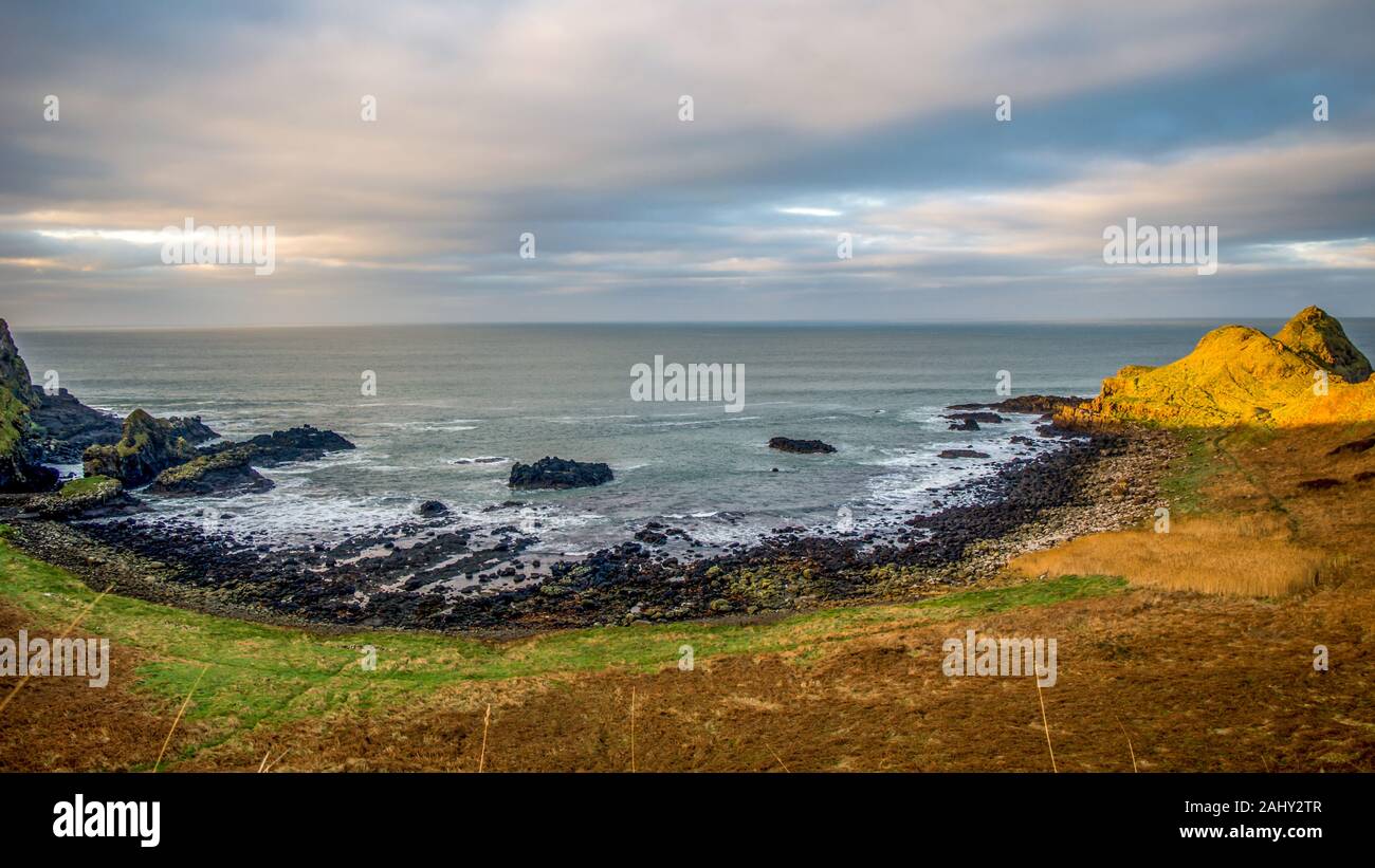 Northern Ireland Antrim Coast Ballintoy Harbour with rocks and sunset ...