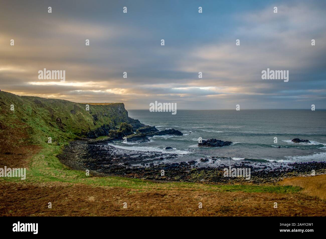 Northern Ireland Antrim Coast Ballintoy Harbour with rocks and sunset ...
