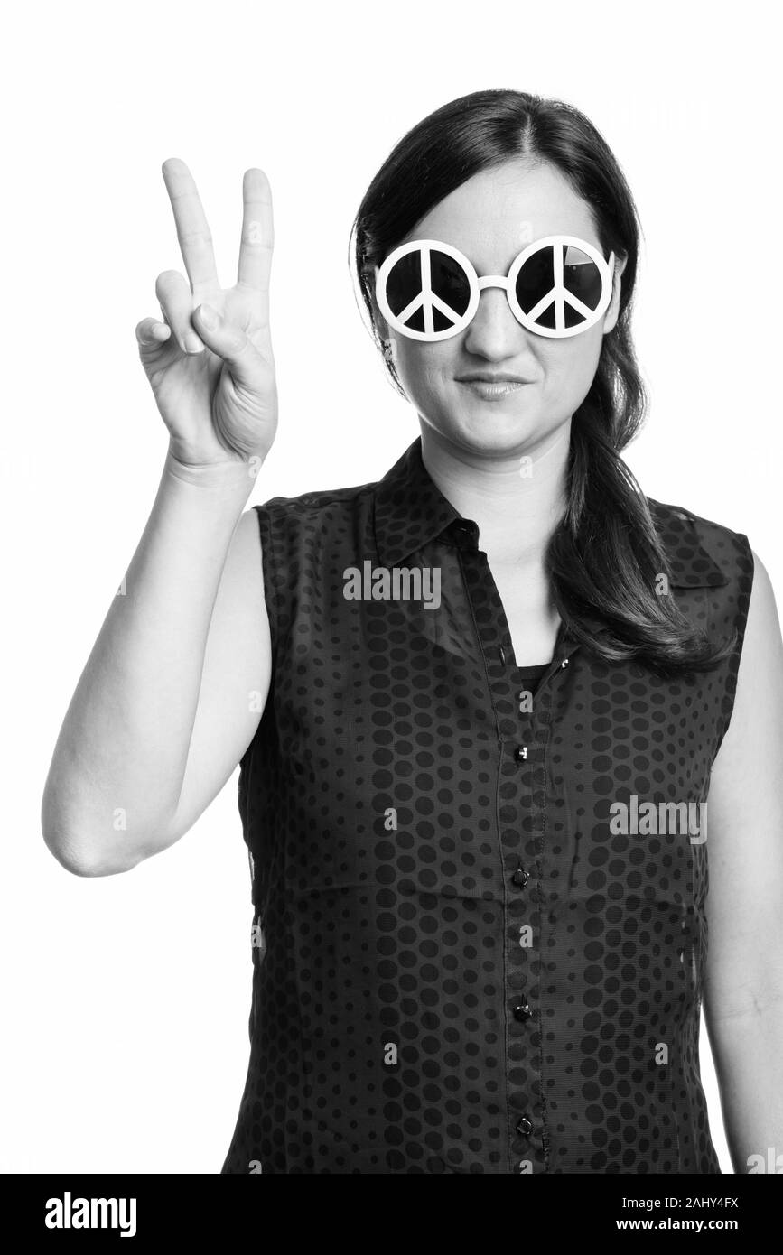 Close up of beautiful woman wearing sunglasses with peace sign and ...