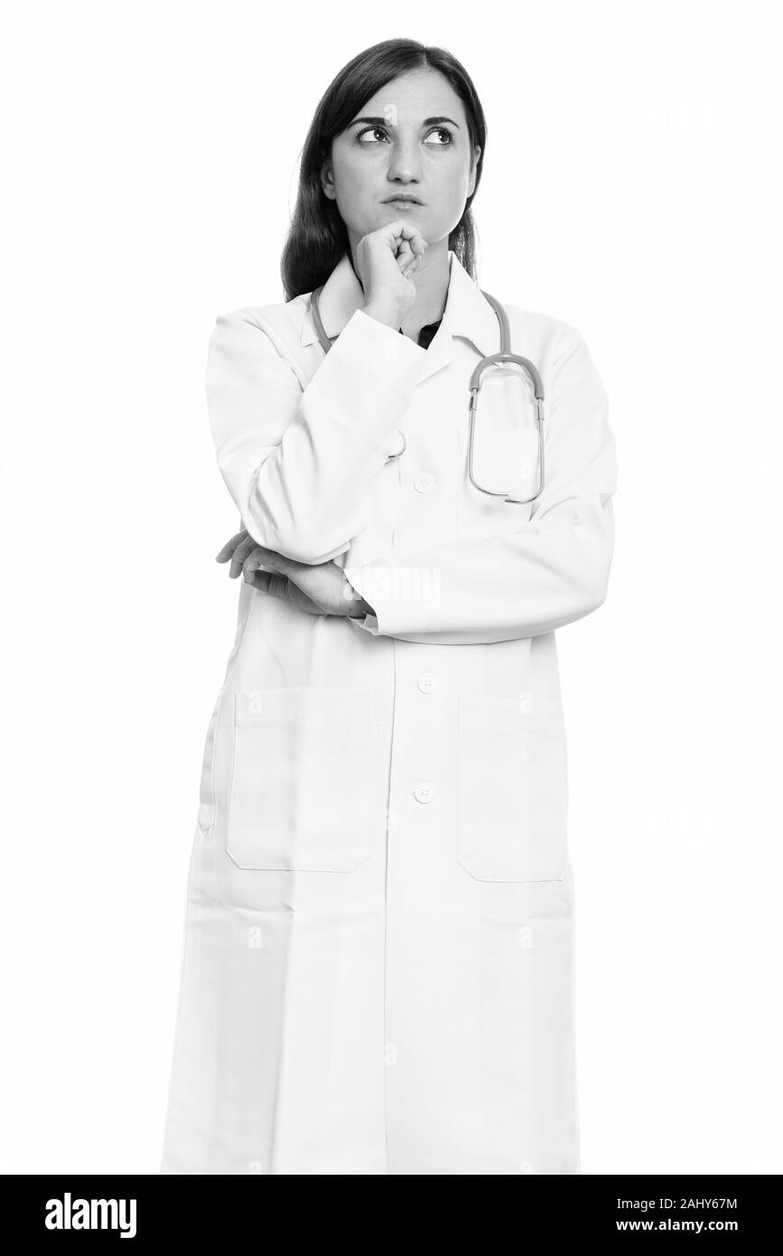 Studio shot of beautiful woman doctor thinking Stock Photo - Alamy
