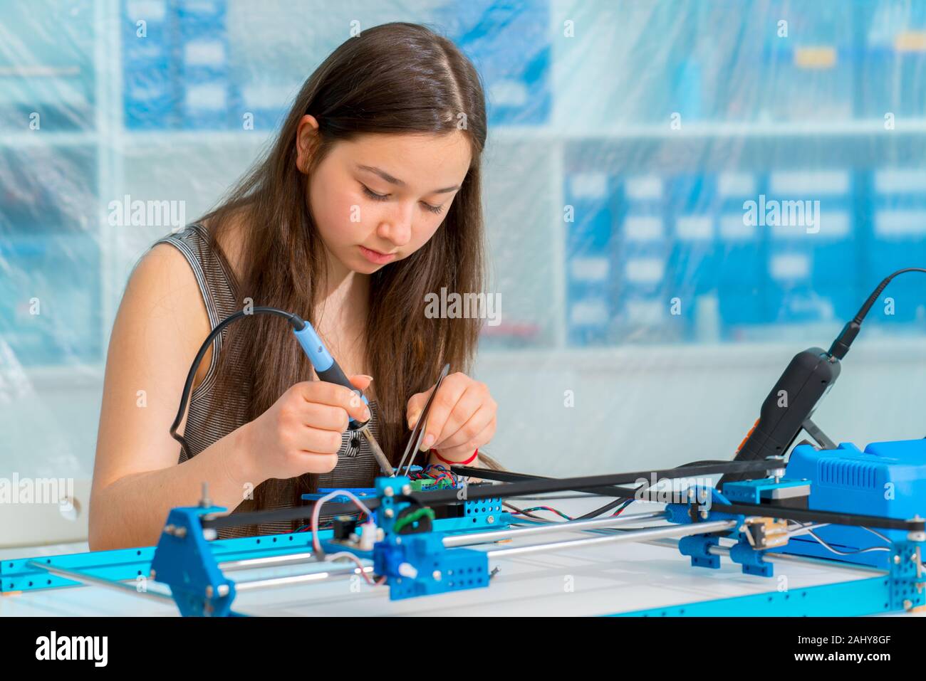 Schoolgirl in the classroom design and development of robots Stock ...