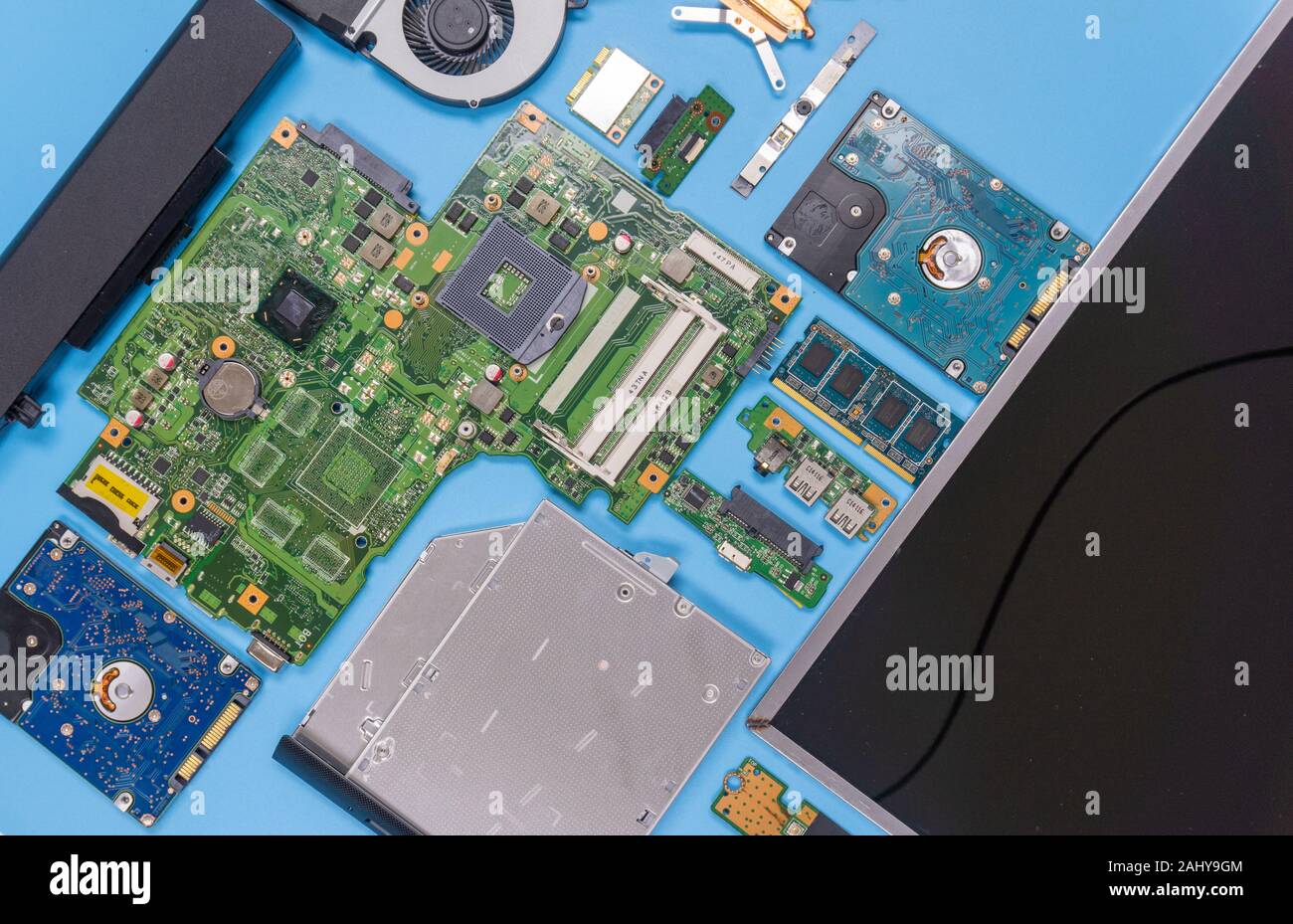 Parts of a modern computer. The insides of a laptop on a blue ...