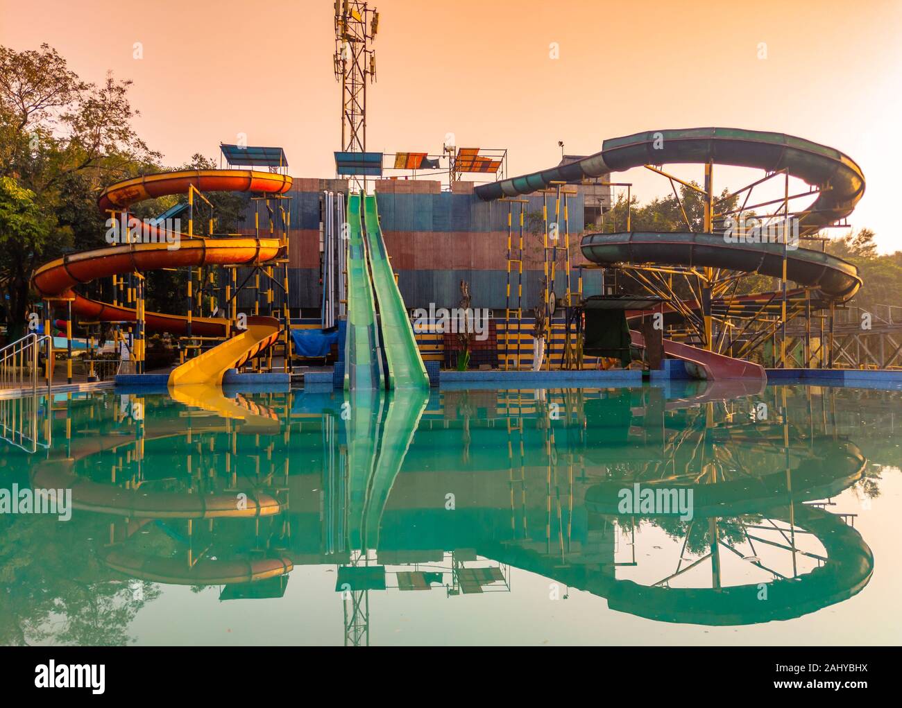 Water Chute ride with Swimming pool at an amusement park Stock Photo ...
