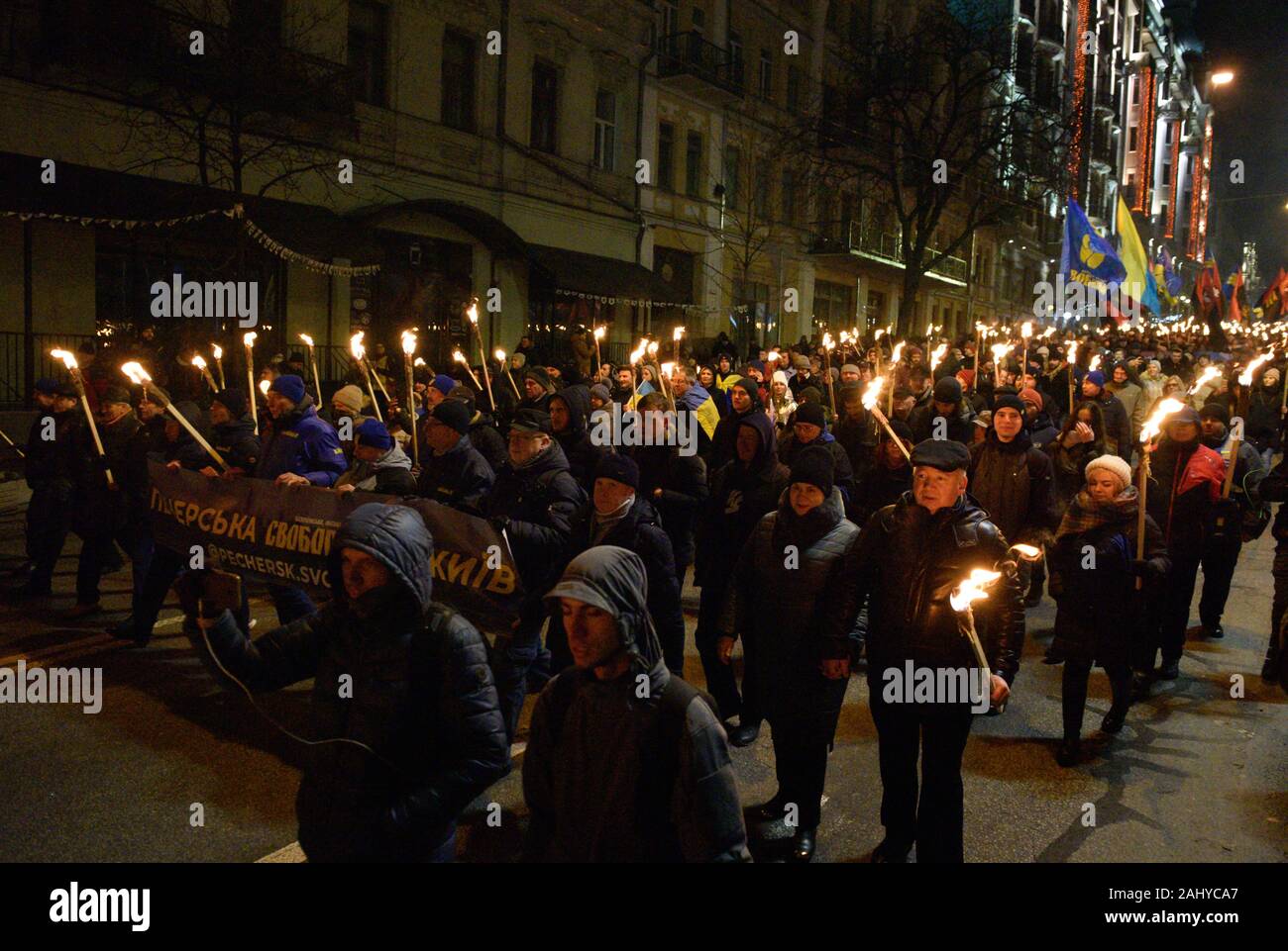 Kiev, Ukraine. 01st Jan, 2020. Participants marching with burning ...