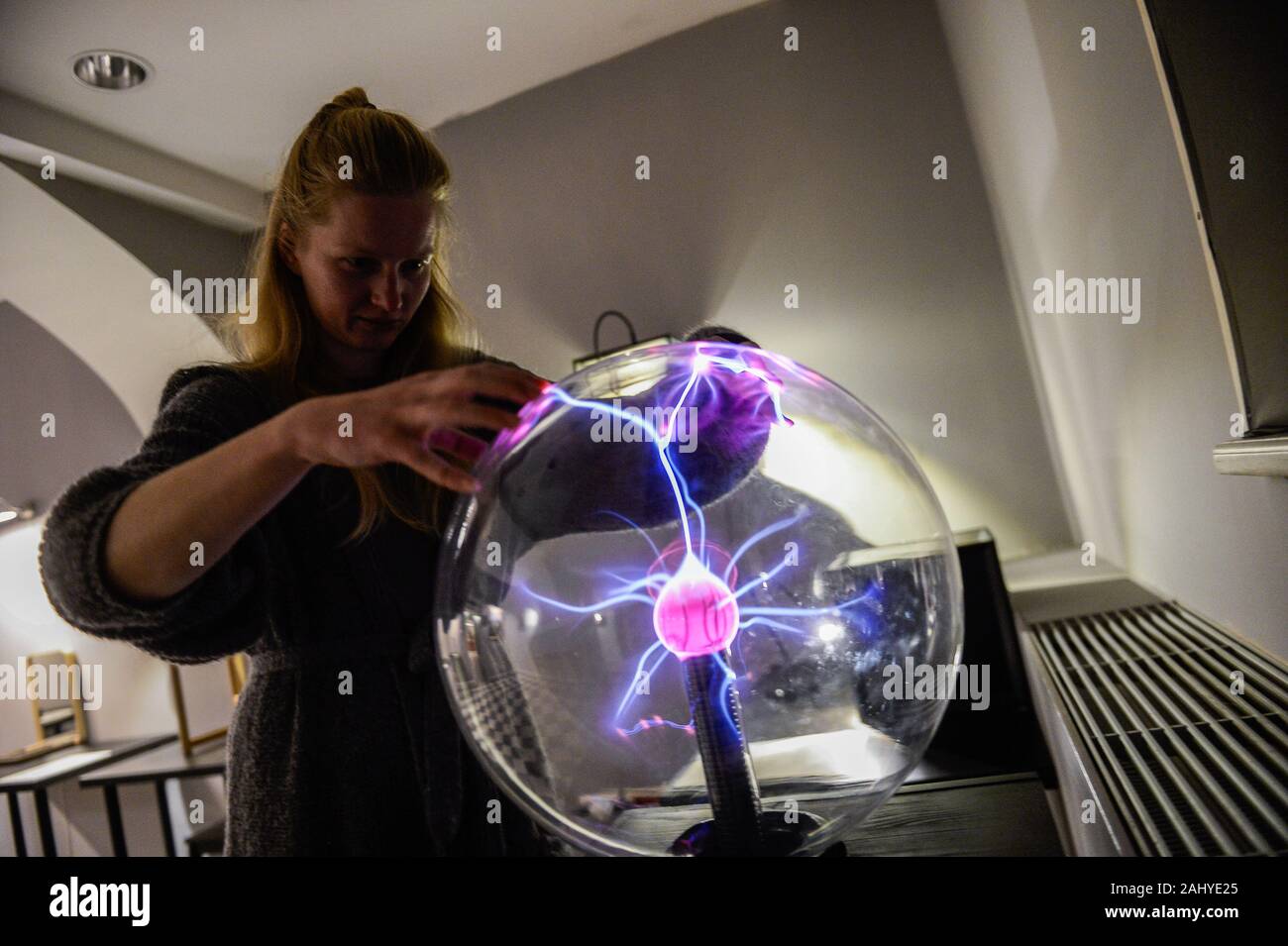 A visitor interacts with an electric illusion at the Museum of ...