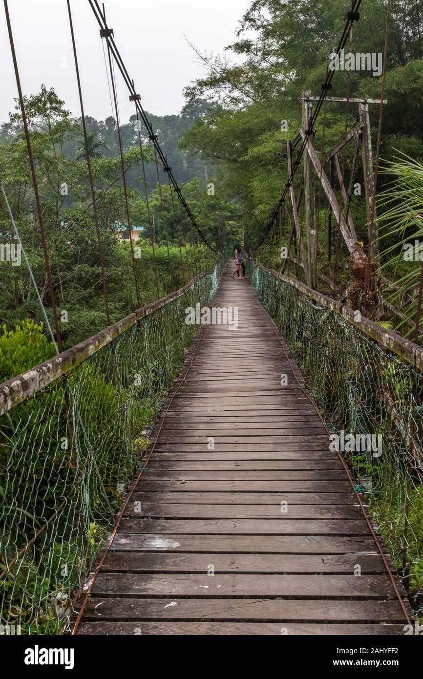 An old wooden suspension bridge at Kampung Maang, Kota Padawan, Sarawak ...