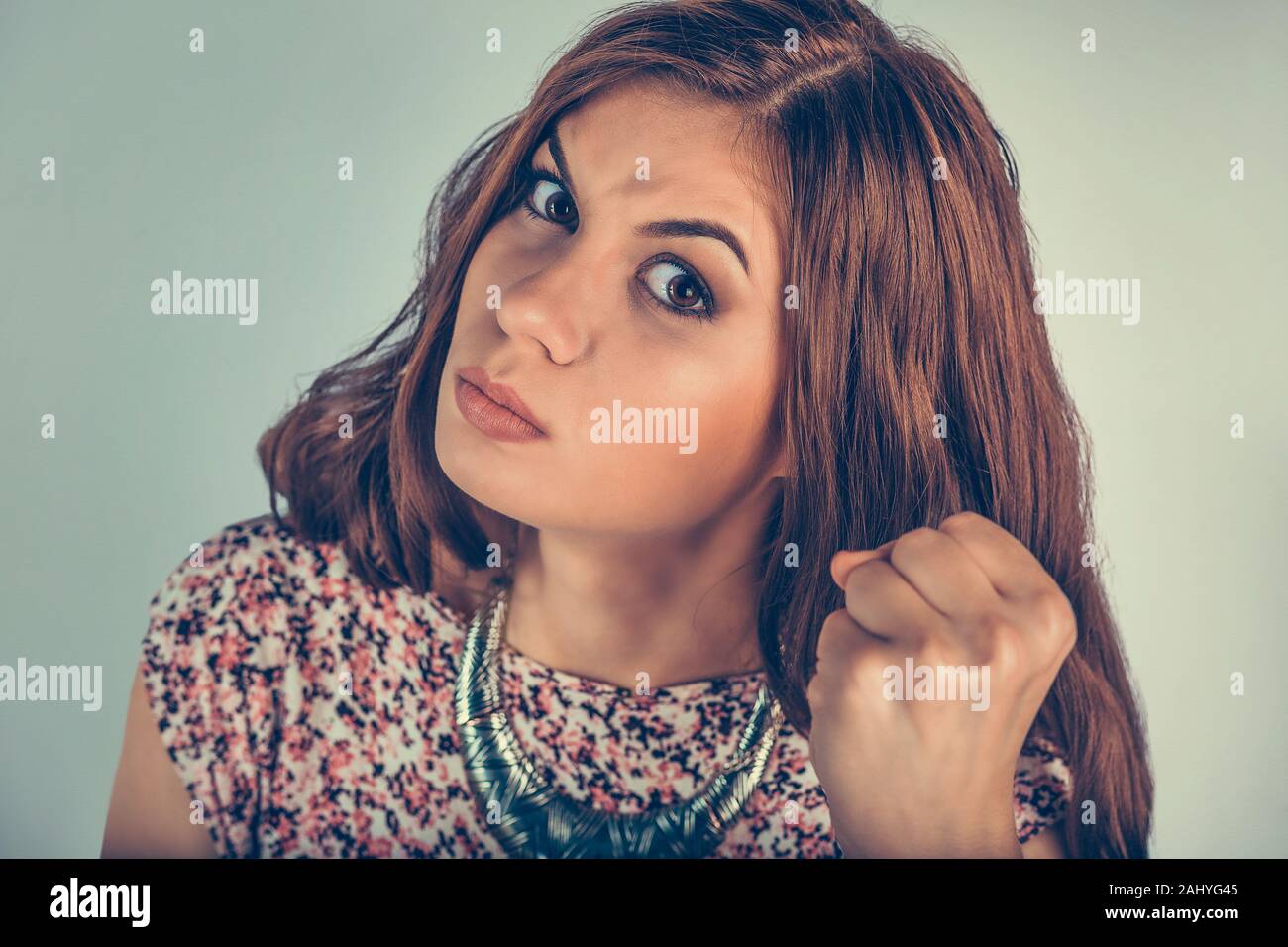 Closeup portrait angry young woman showing fist about to punch hit ...