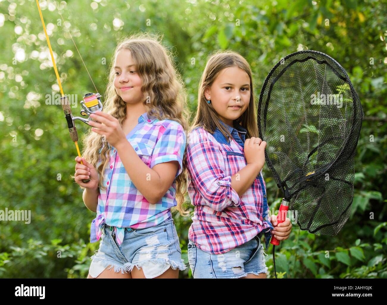 Fishing skills. Summer hobby. Happy smiling children with net and rod ...