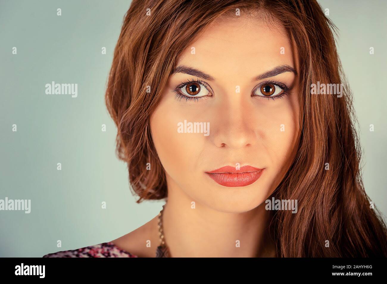 Portrait extra closeup crop image of young woman looking serious at you ...