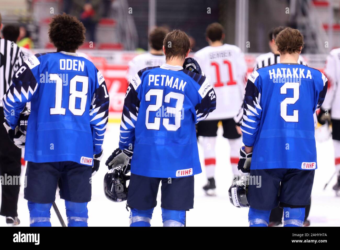 Dejected Finnish players (L-R) Joonas Oden, Ville Petman and Santeri Hatakka line up after their ...