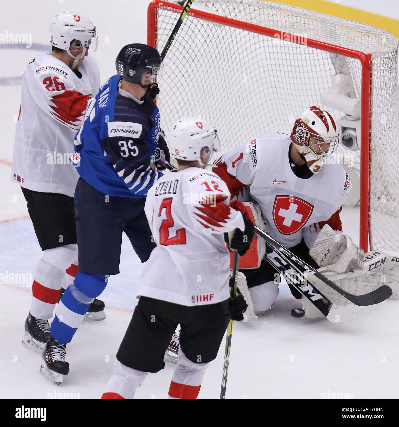 L-R David Aebischer (SUI), Aku Raty (FIN) and Bastian Guggenheim and ...