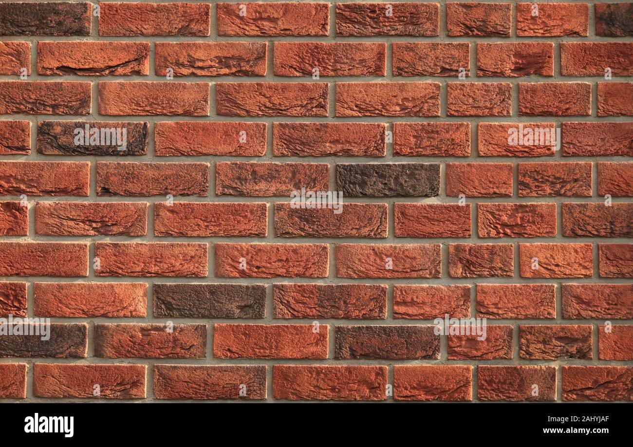 Decorative wall texture, background. Rusty, matted, red bricks. The ...