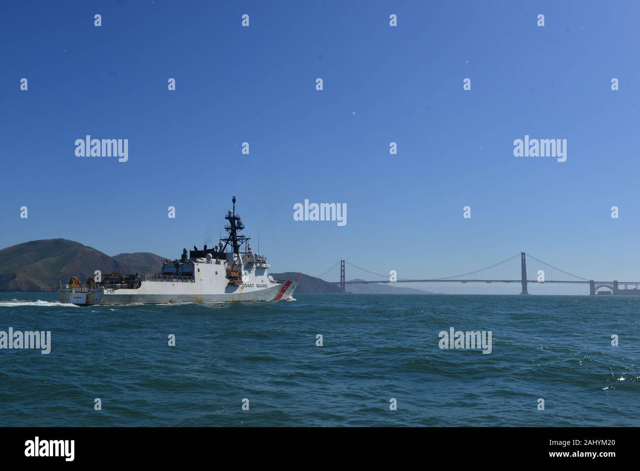 The crew aboard the U.S. Coast Guard Cutter Bertholf (WMSL 750) enters ...