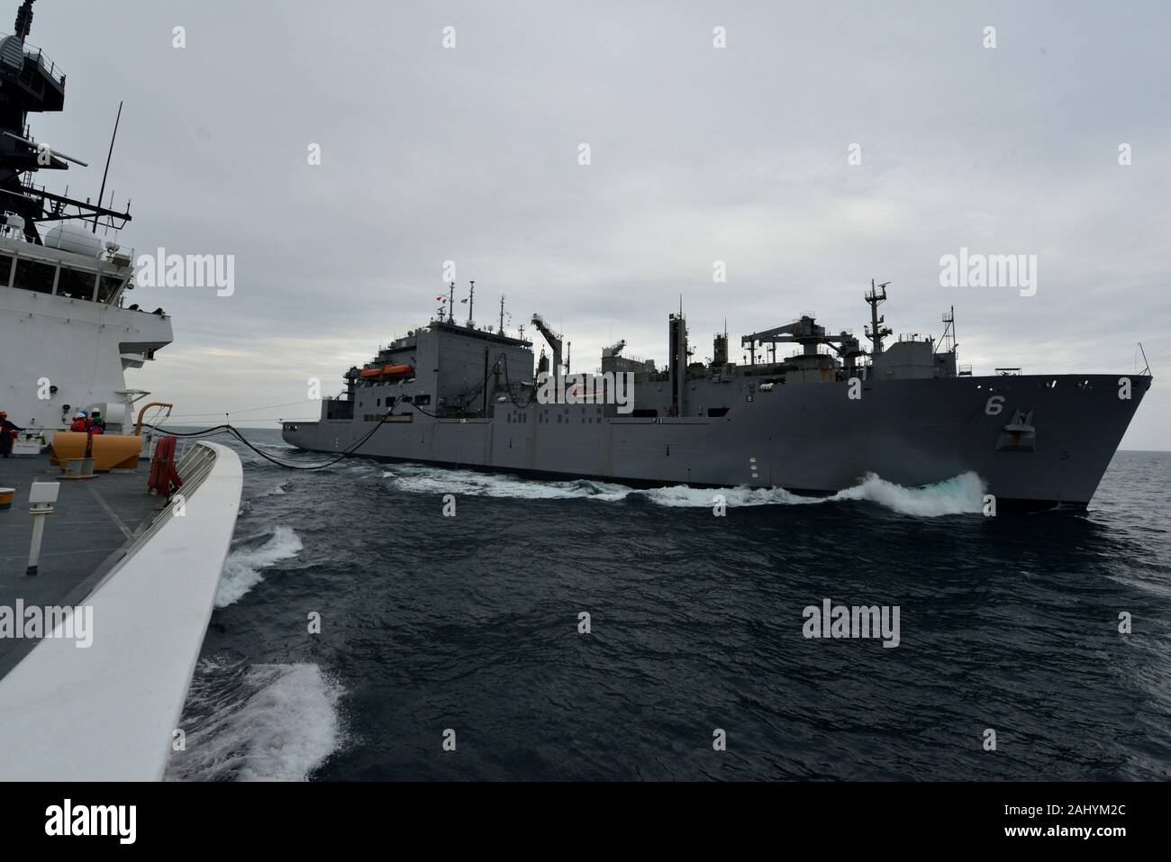U.S. Coast Guard Cutter Bertholf (WMSL 750) transits alongside the USNS ...