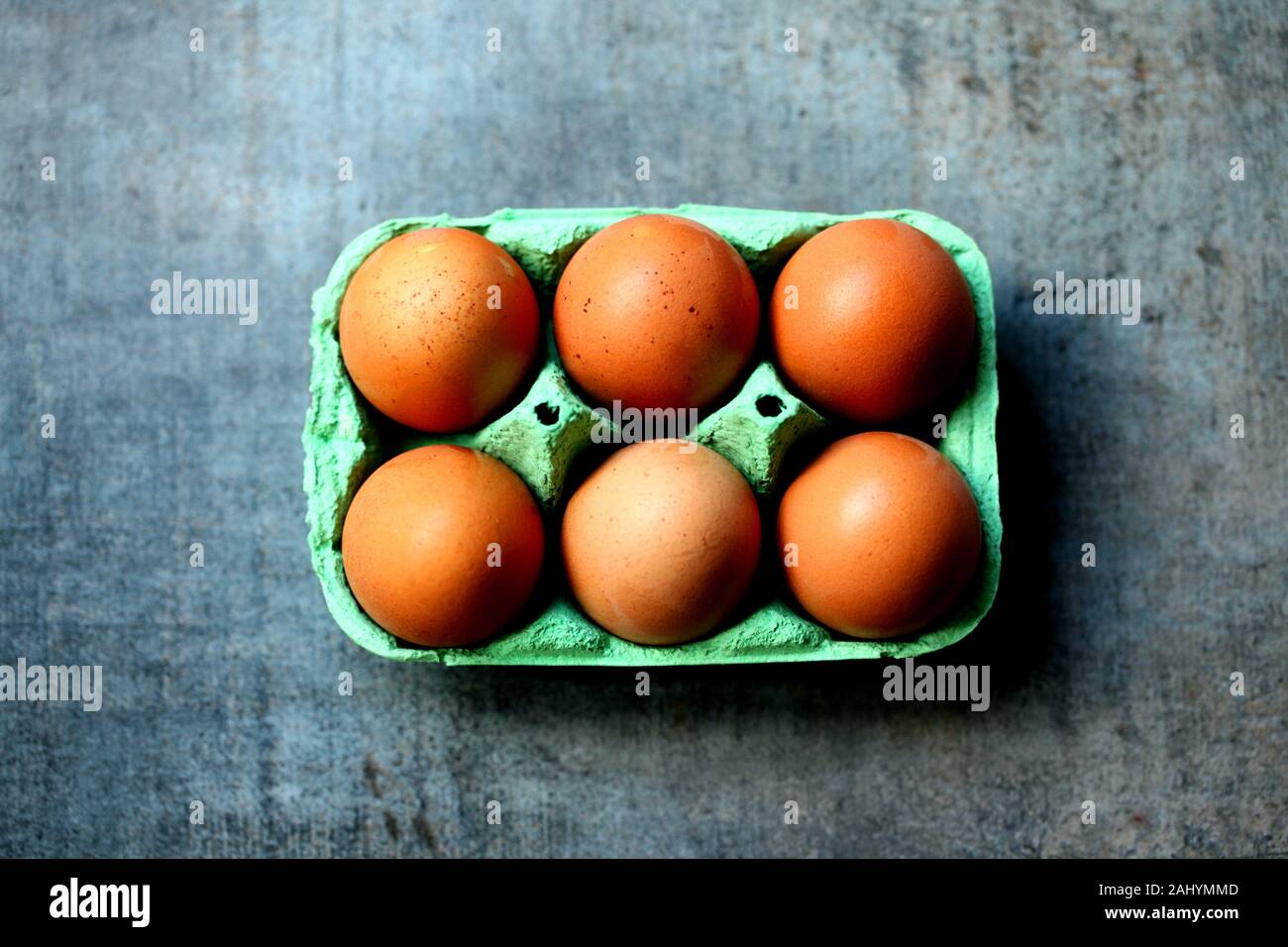 Green egg box on artistic background Stock Photo - Alamy