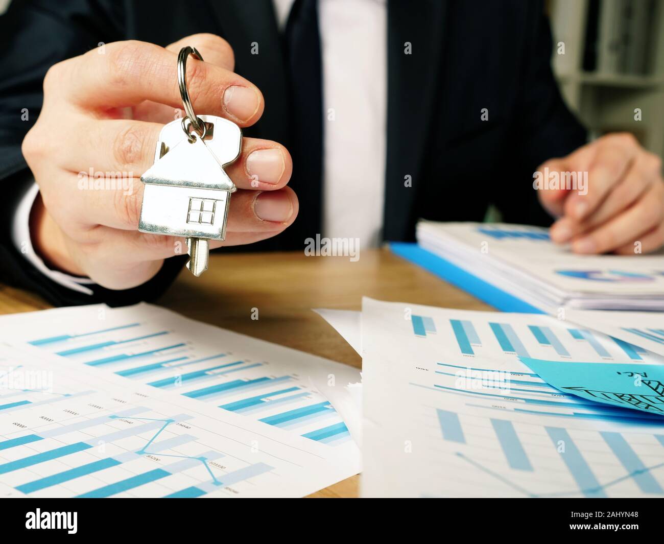 Real estate agent giving house keys hi-res stock photography and images ...