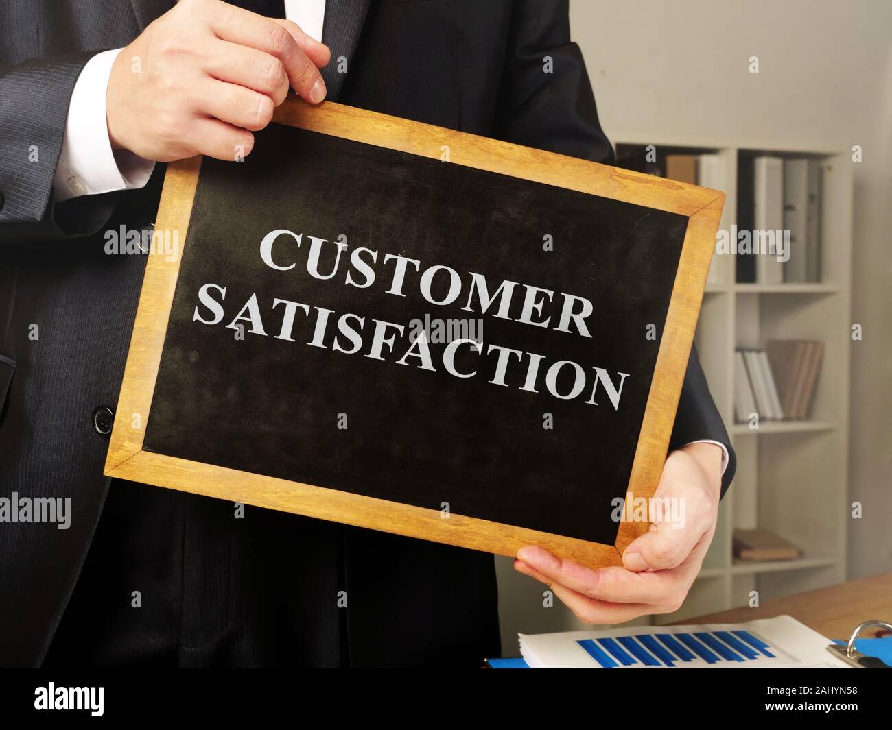 Customer satisfaction sign on the blackboard Stock Photo - Alamy