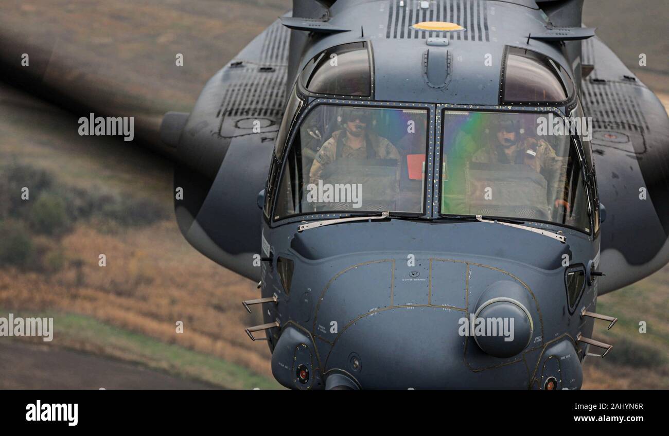 U.S. airmen assigned to the 352d Special Operations Wing fly a CV-22B ...