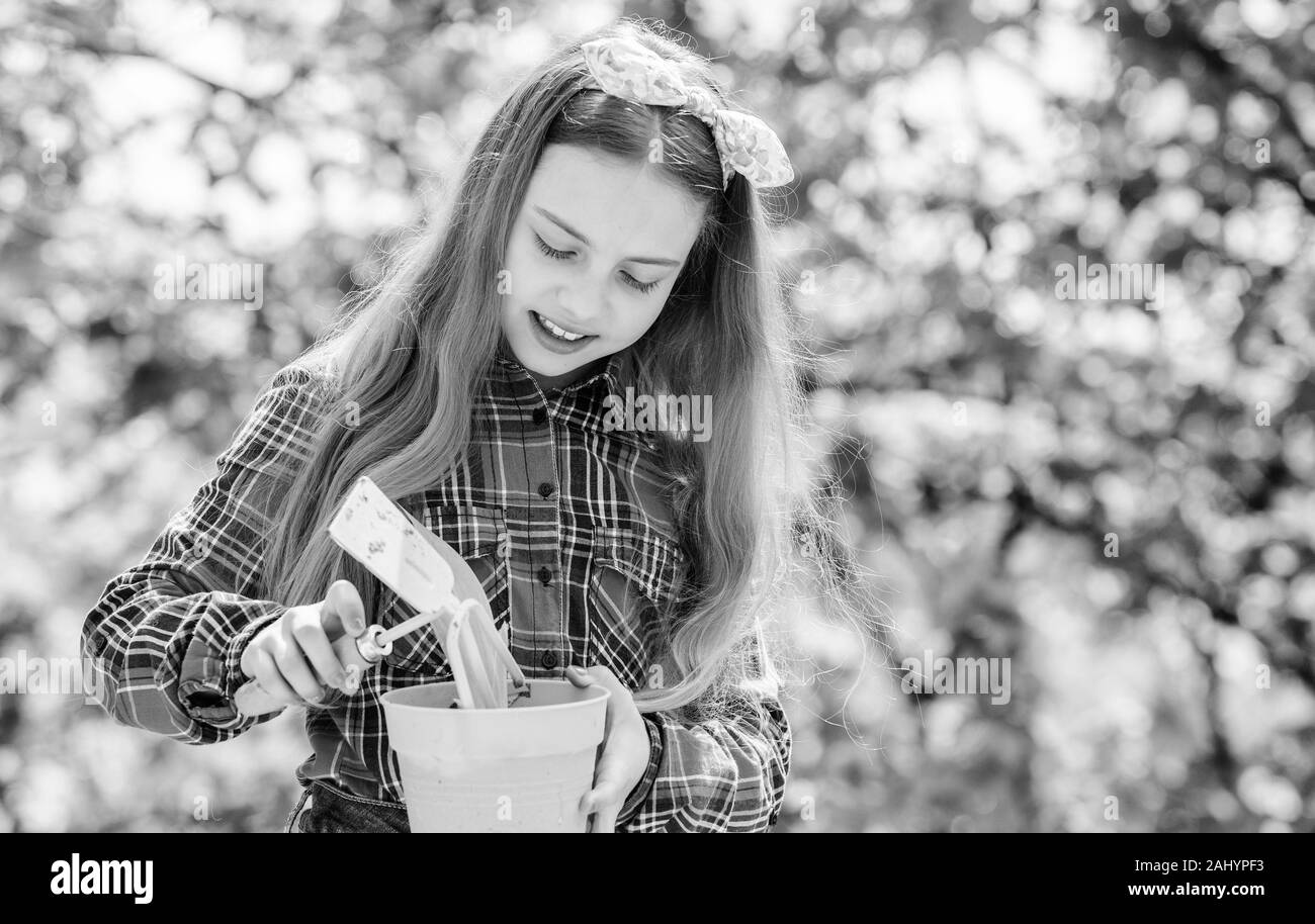 Ecology education. Little girl planting plants. Planting season. Garden ...