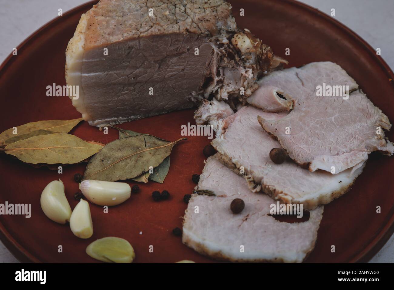 baked ham with chapel, bay leaf and Italian herbs Stock Photo - Alamy
