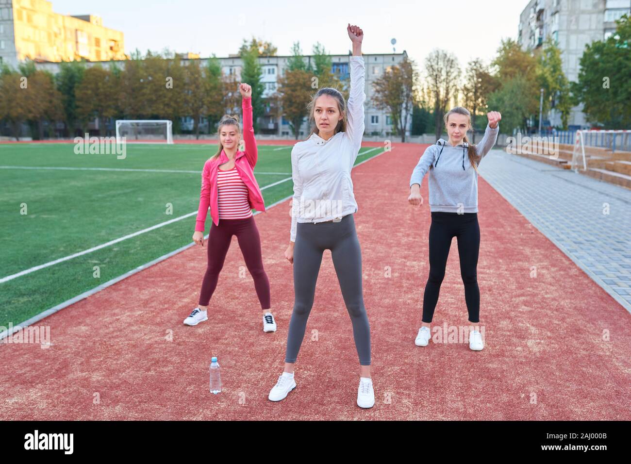 Positive women doing sport exercises..The group of three beautiful ...