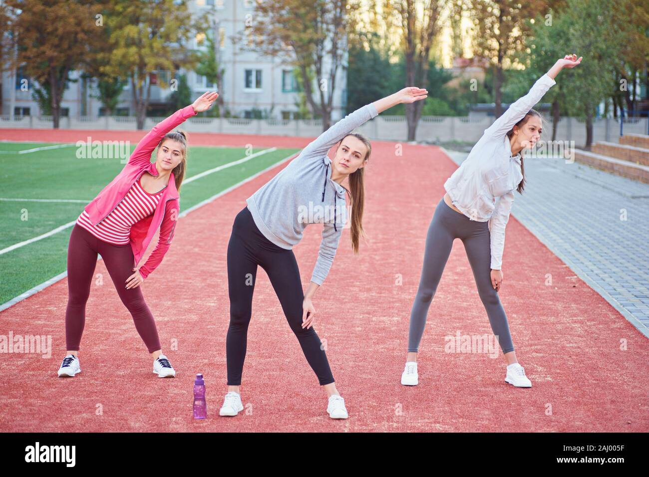 Positive women doing sport exercises..The group of three beautiful ...
