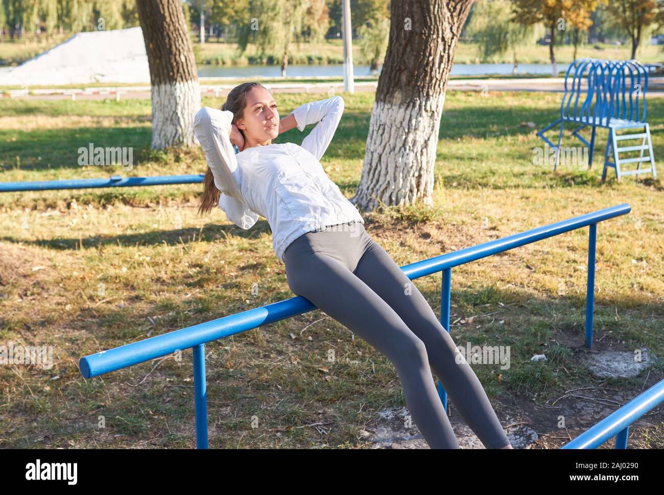 girl doing sports on the sports ground training exercise exercise ...