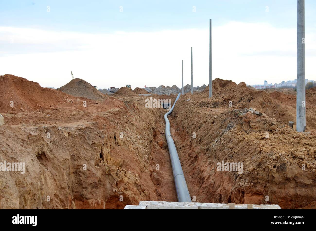 Laying of underground storm sewer pipes. Installation of water main ...