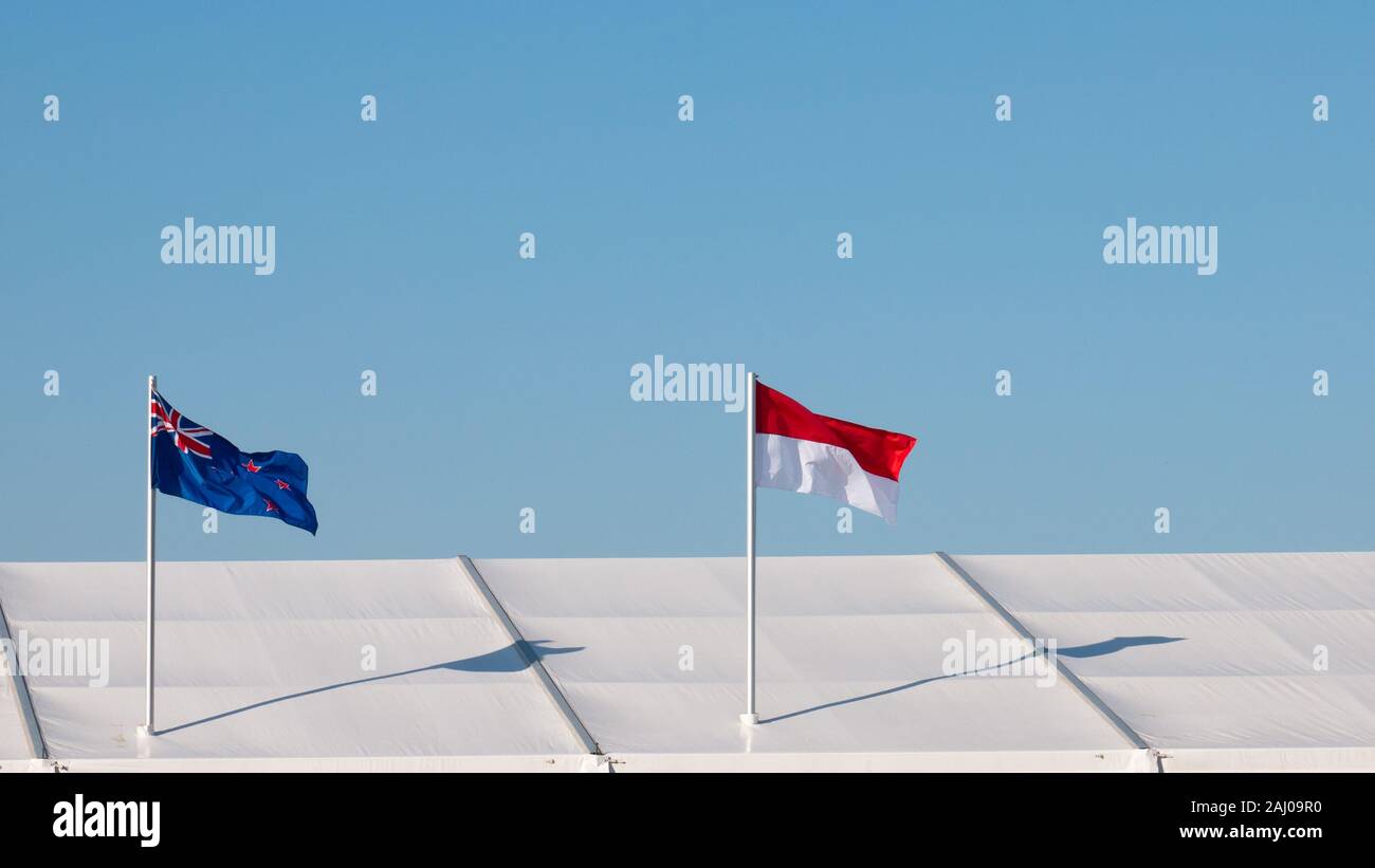New Zealand and Monaco flags side by side Stock Photo - Alamy
