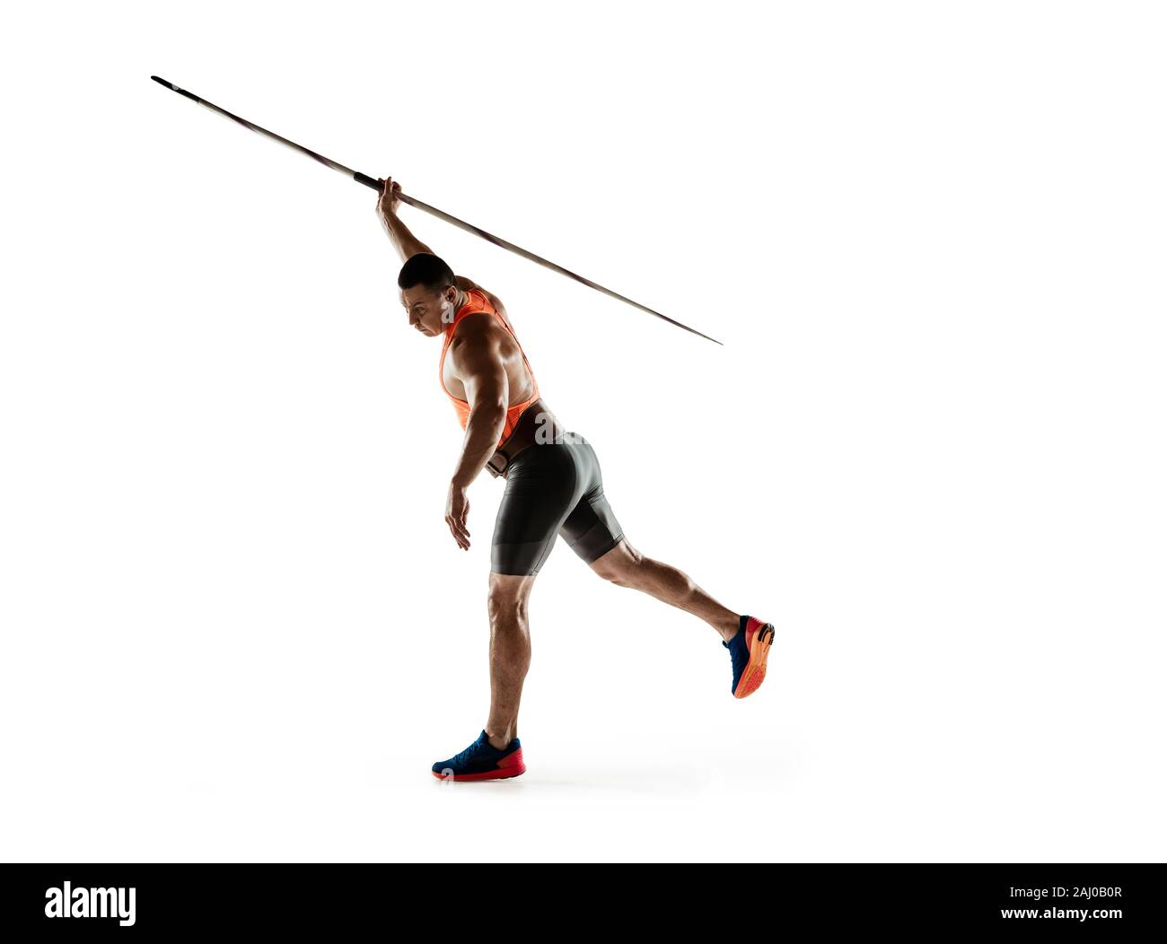 Male athlete practicing in throwing javelin isolated on white studio ...