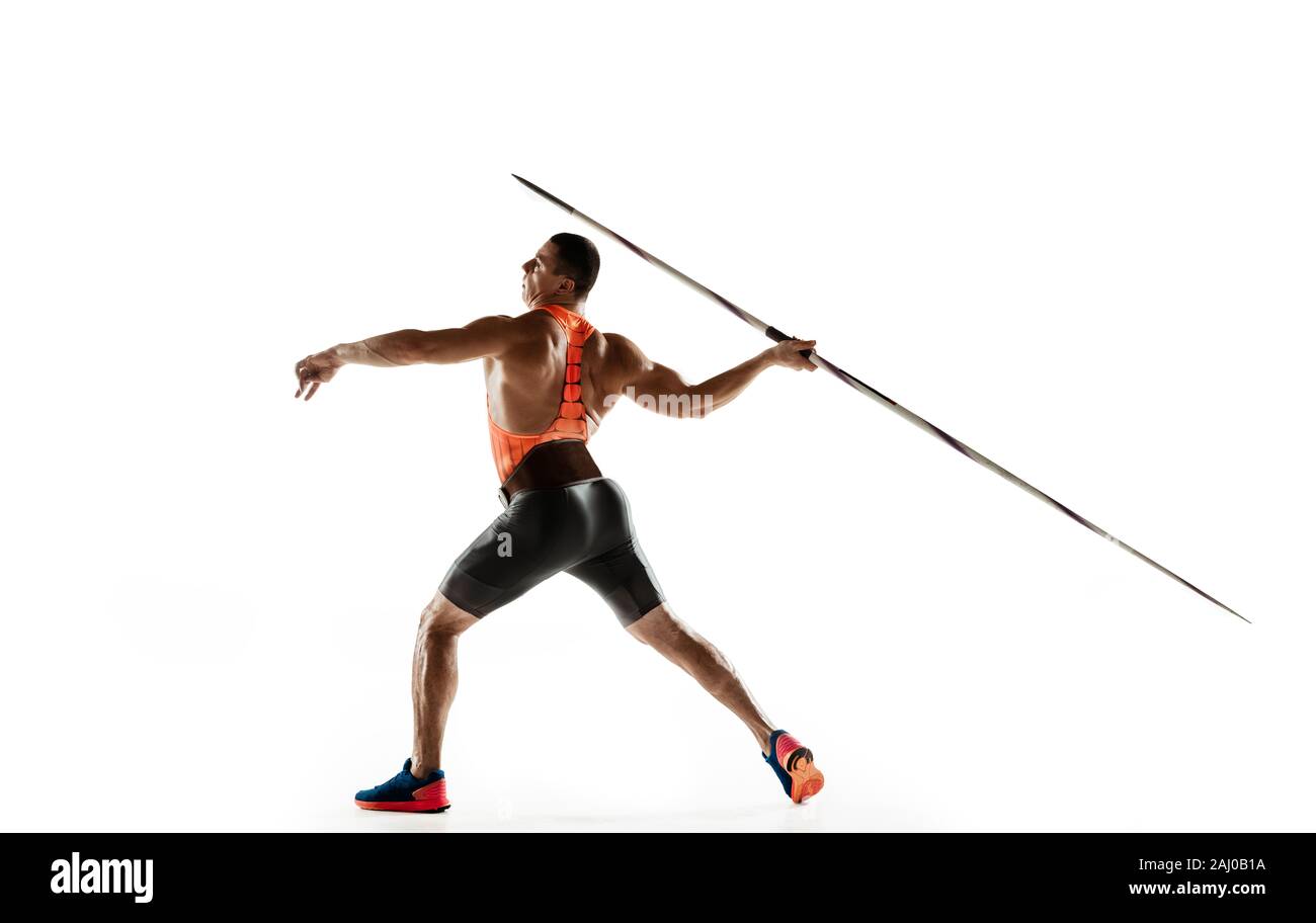 Male athlete practicing in throwing javelin isolated on white studio ...