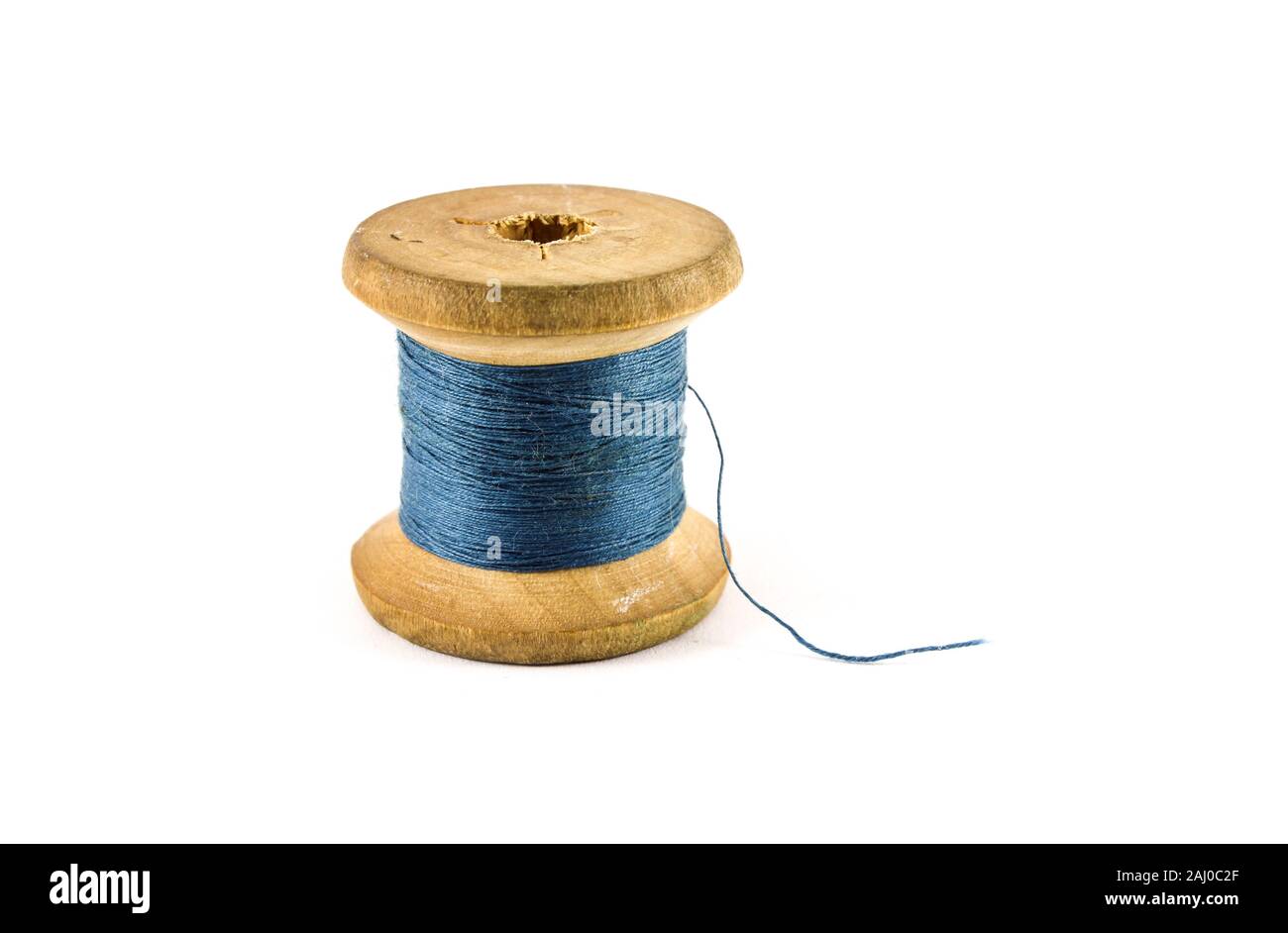 Spool with blue thread isolated on white background Stock Photo - Alamy