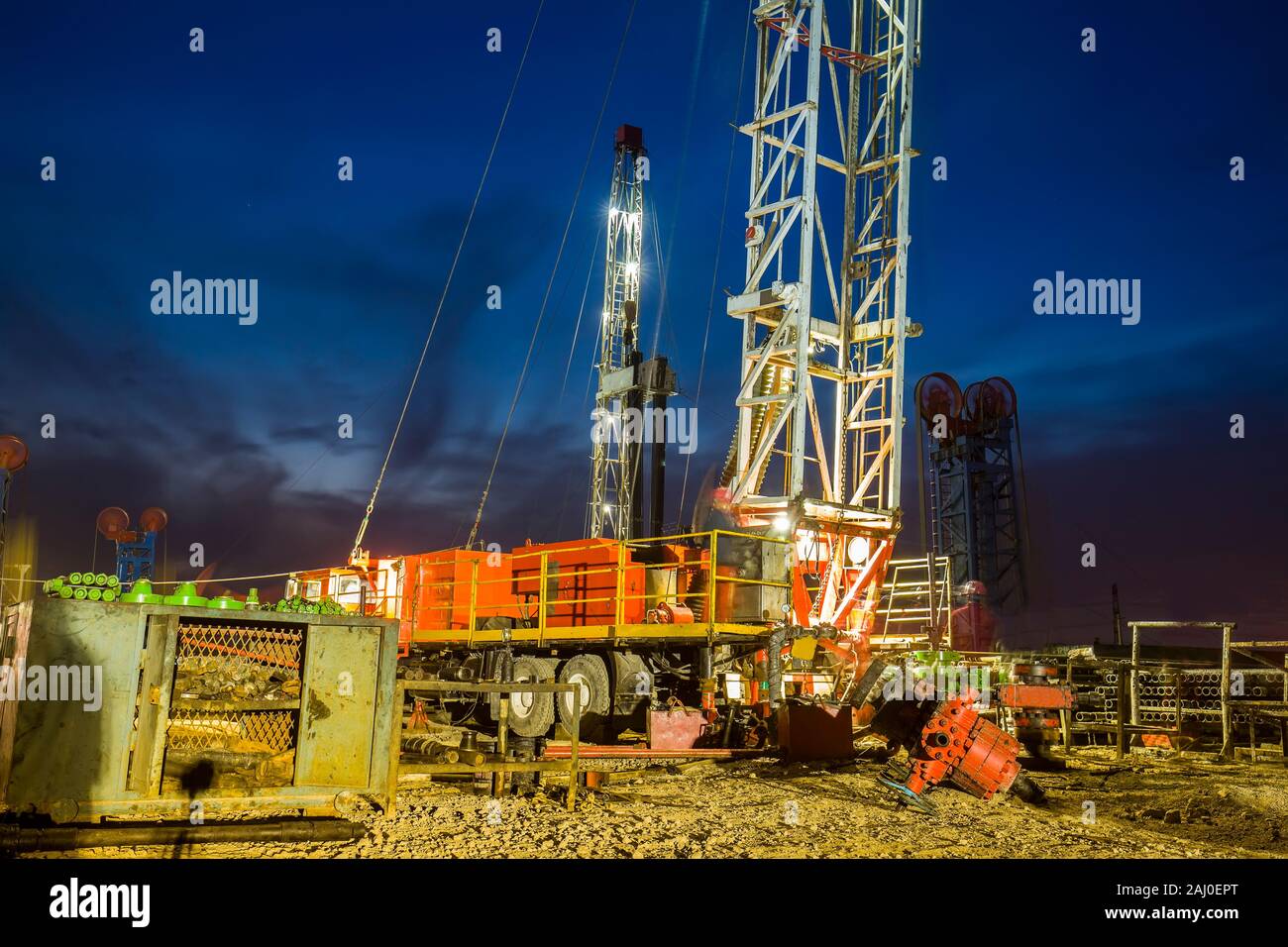 In the evening of oilfield derrick Stock Photo - Alamy