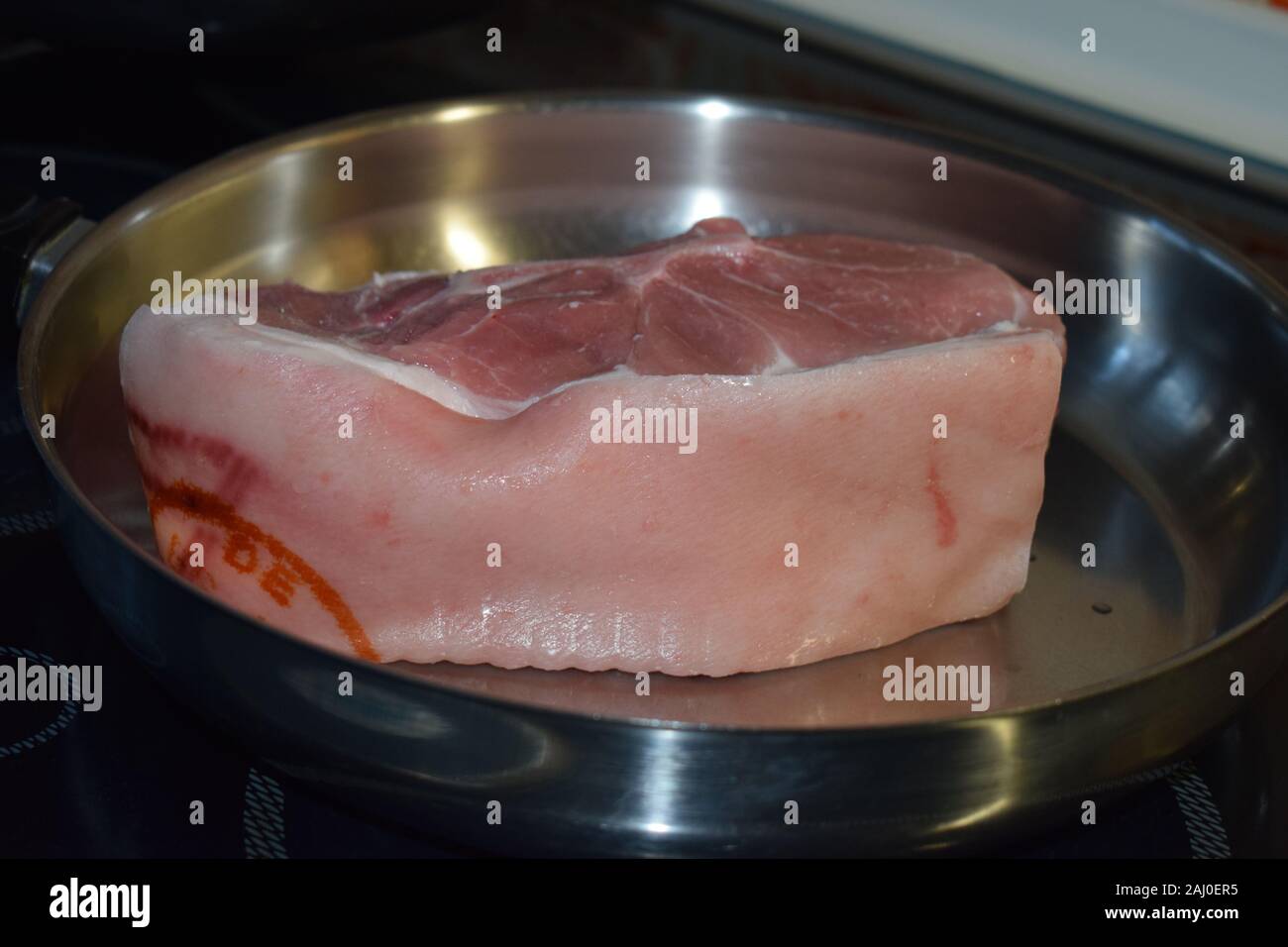 frying meat in a pan Stock Photo - Alamy