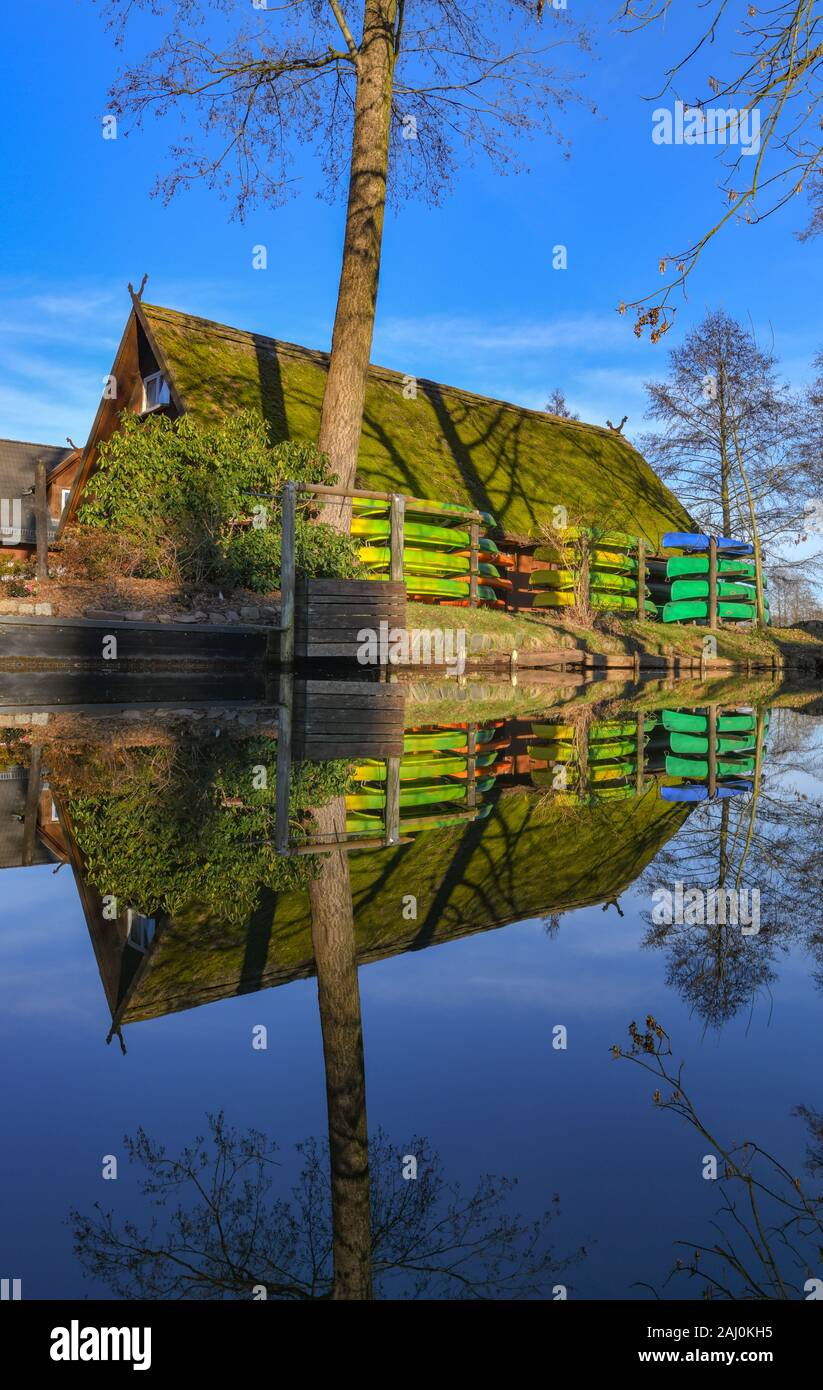 Leipe, Germany. 02nd Jan, 2020. Canoes lie on the banks of a river in ...