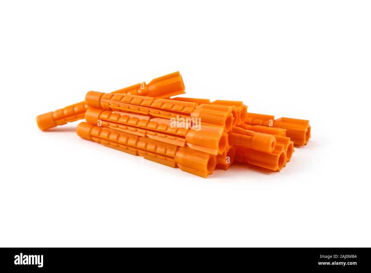 Handful of plastic dowels isolated on white background Stock Photo - Alamy