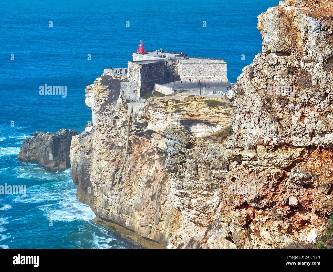 Famous lighthouse in Nazare in Portugal surrounded by Atlantic ocean ...