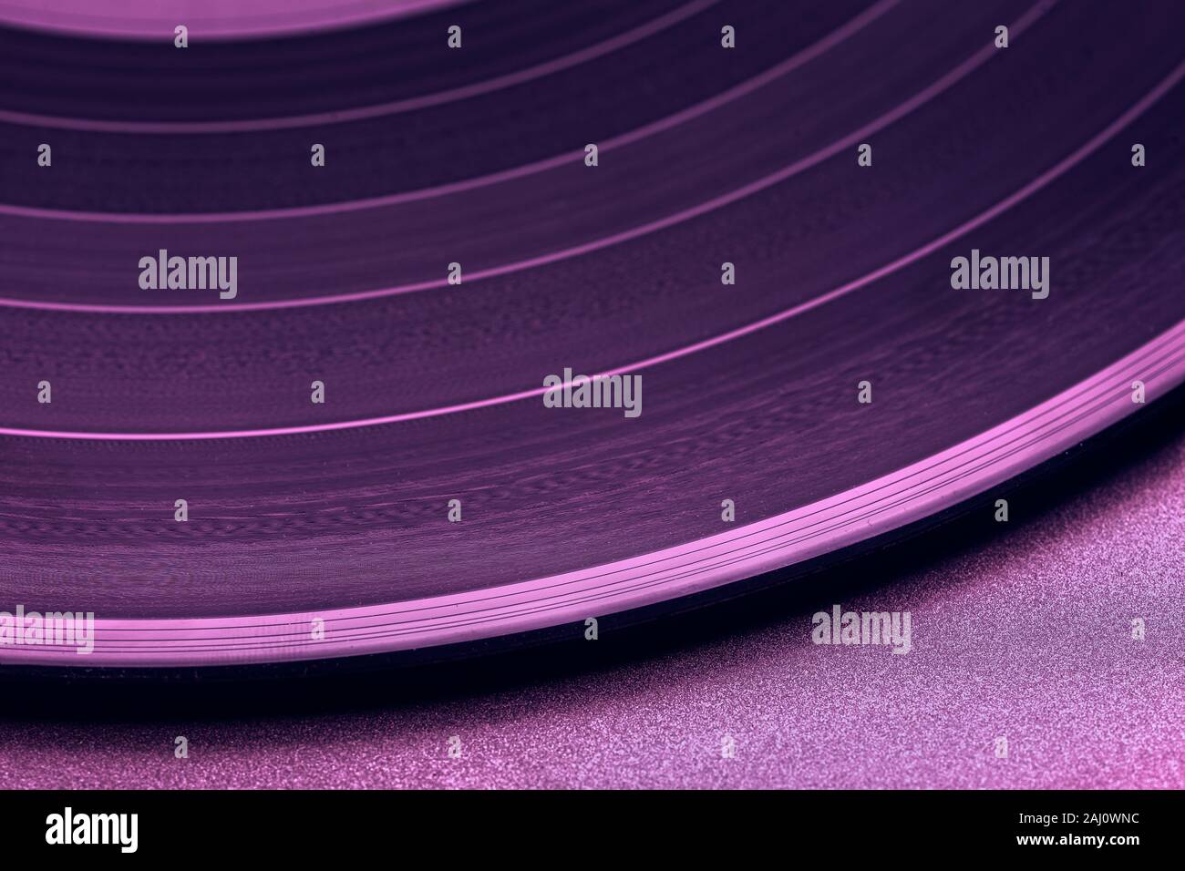 Old colorful Vynil disc playing music, background image Stock Photo - Alamy