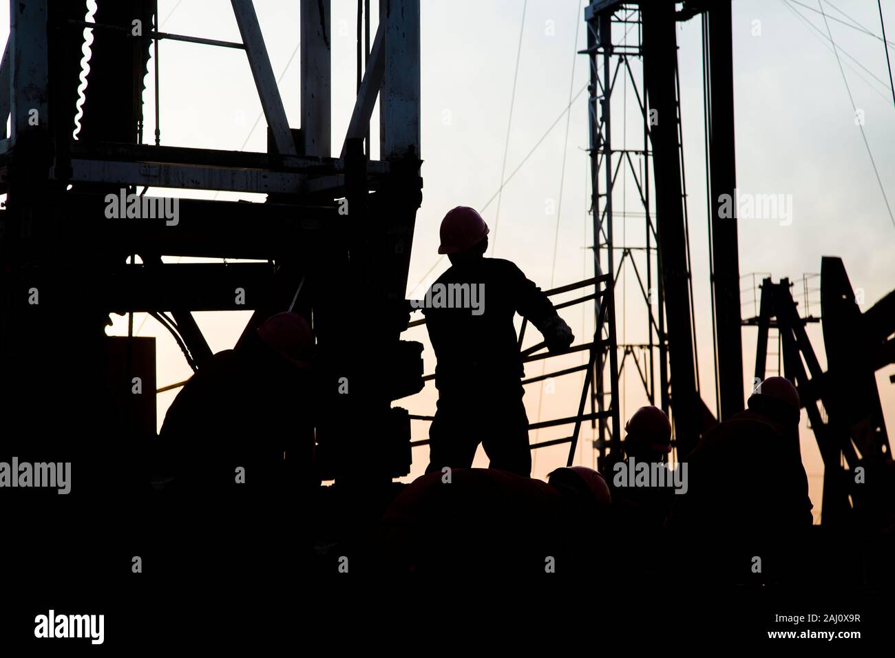 oil field, the oil workers are working Stock Photo - Alamy