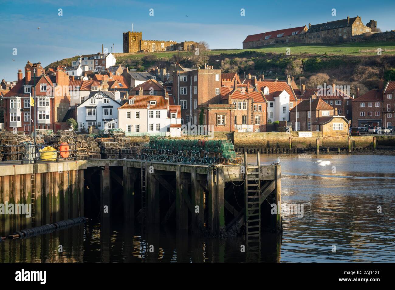St Mary's Church on the cliff top overlooking Whitby harbour and the ...