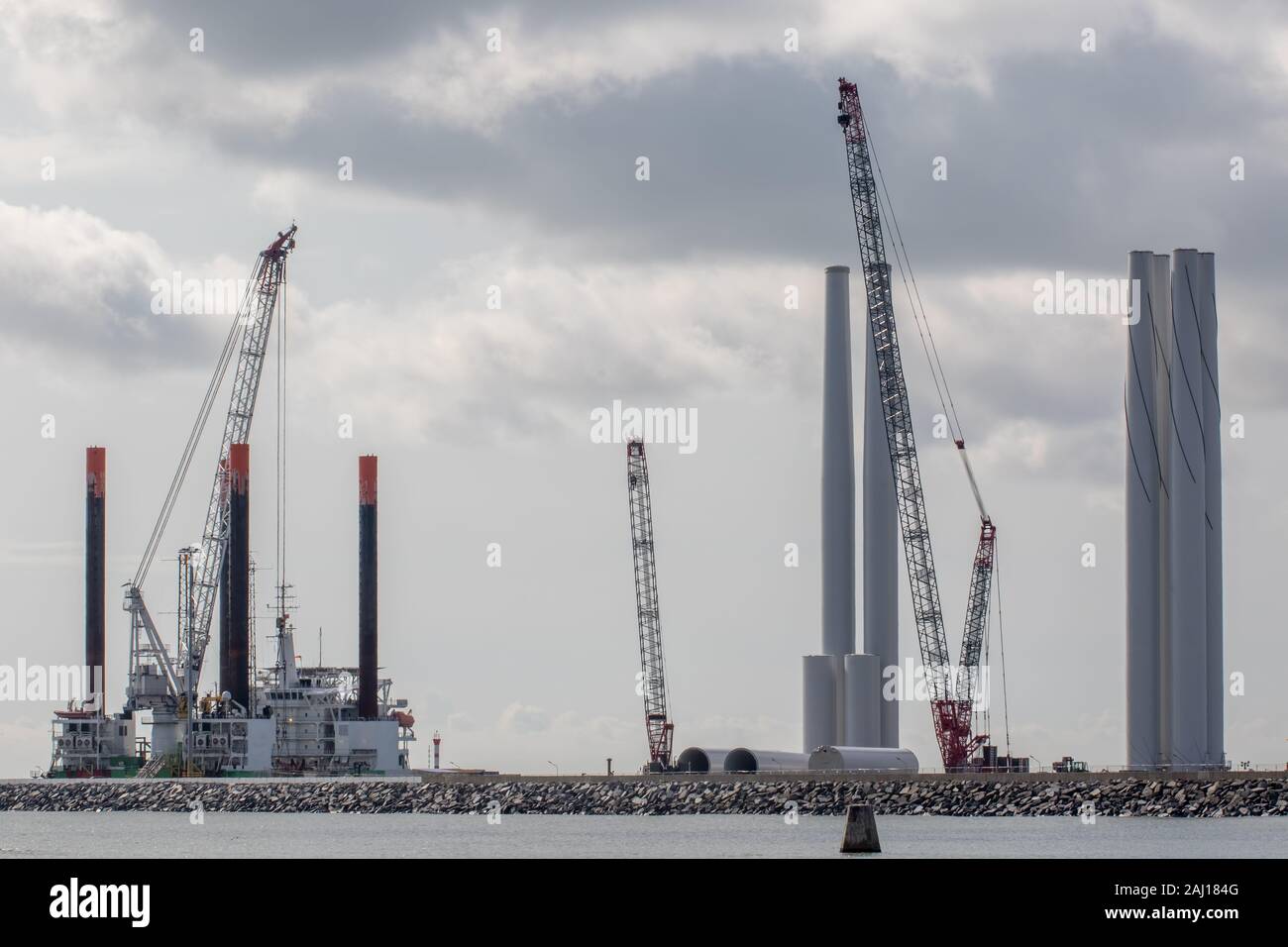 Renewable energy investment. Offshore wind farm turbine construction ...