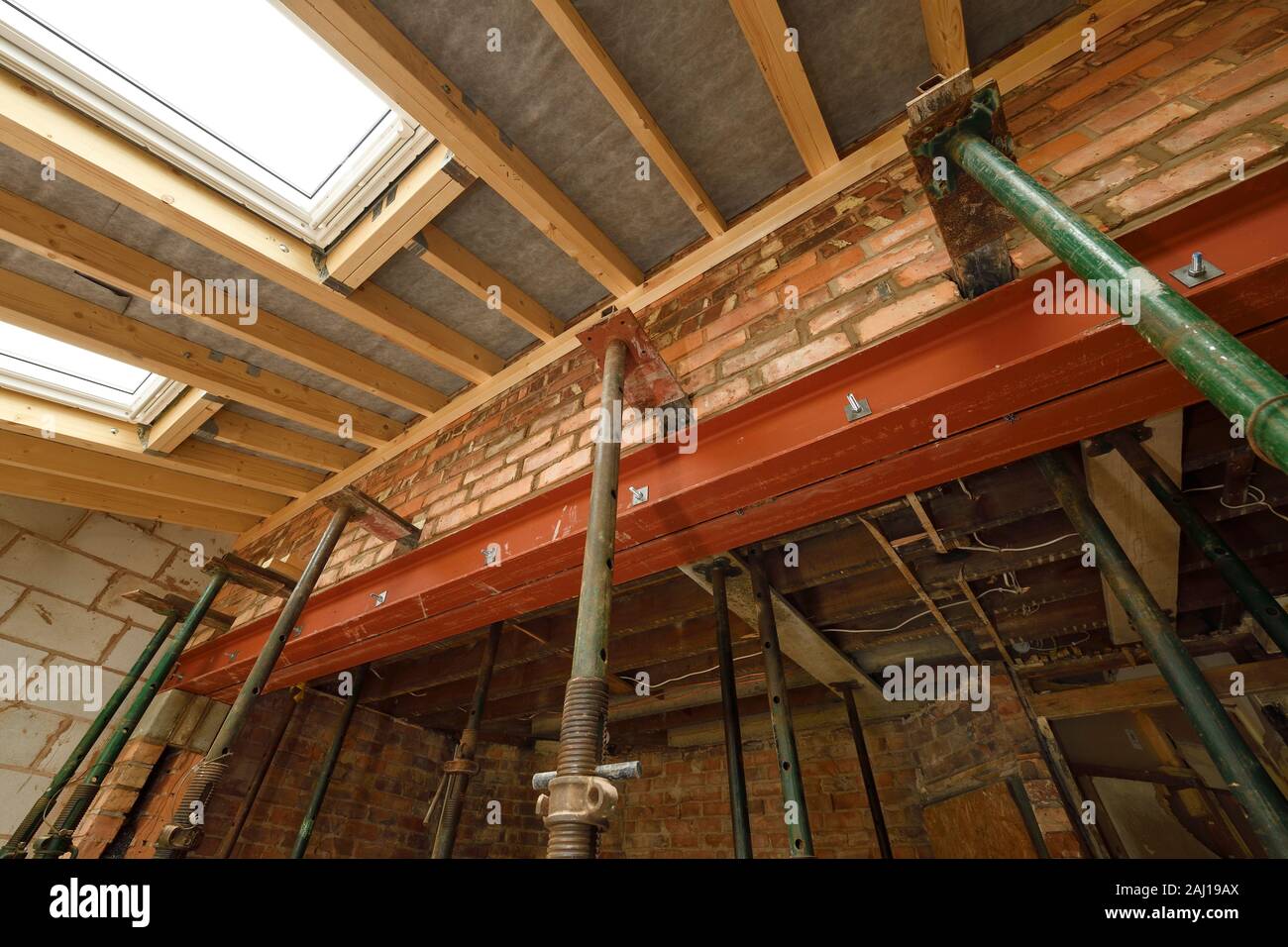 A 1930s property in the UK with the rear wall held up with props and ...