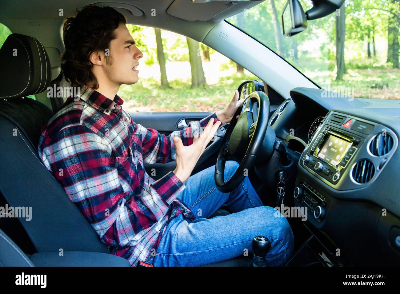 Angry male driver speeding very fast showing anger as roadrage Stock ...