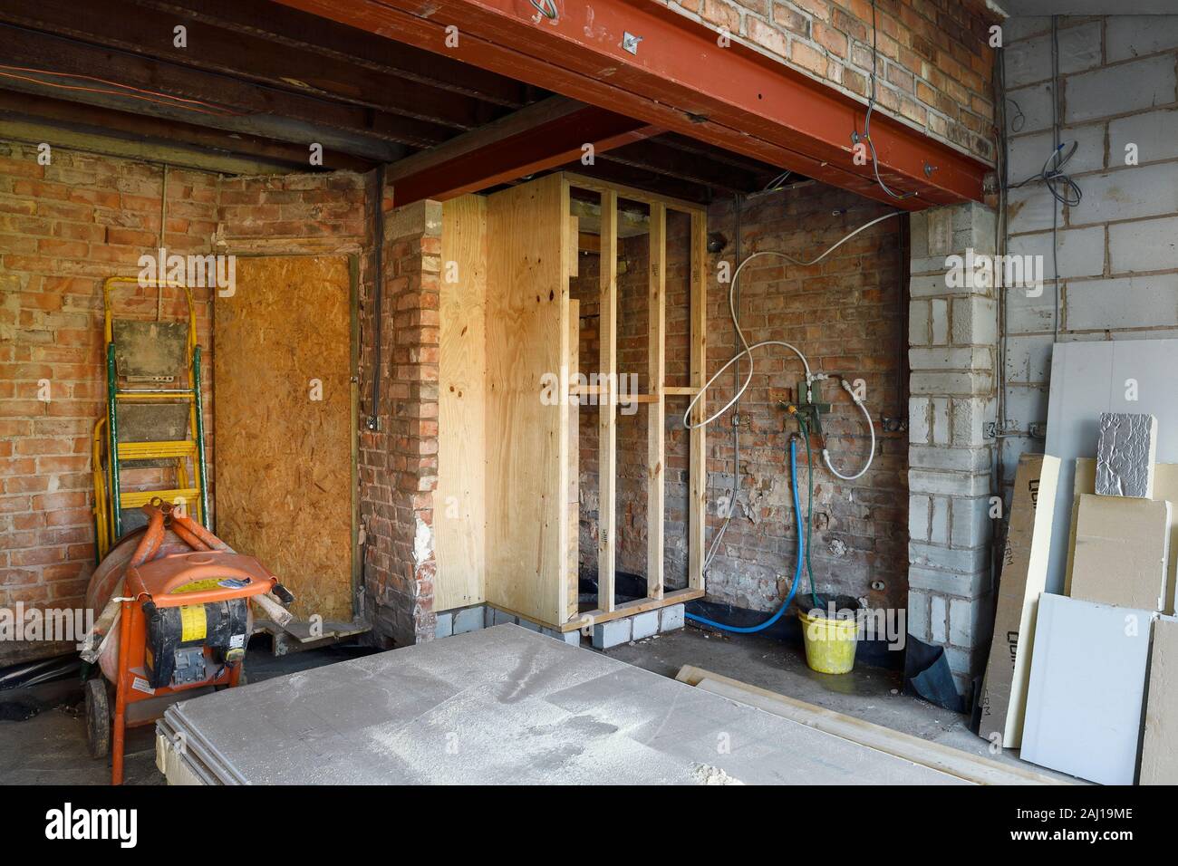 The bare interior shell of a rear extension project at a house in ...