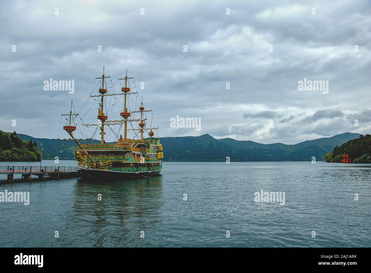 A pirate ship approaches a quay on Lake Ashi, Hakone, Japan. Historical ...